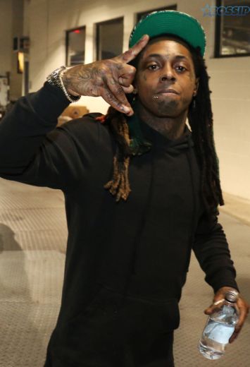 14 Pics Of Rappers In Women's Clothing