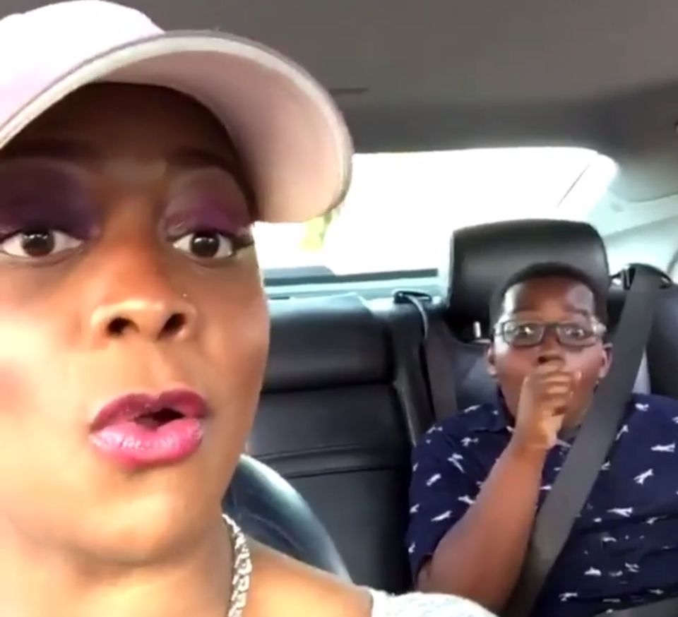 Young Boy "Accidentally" Tosses Up Middle Finger For Photo With Mom